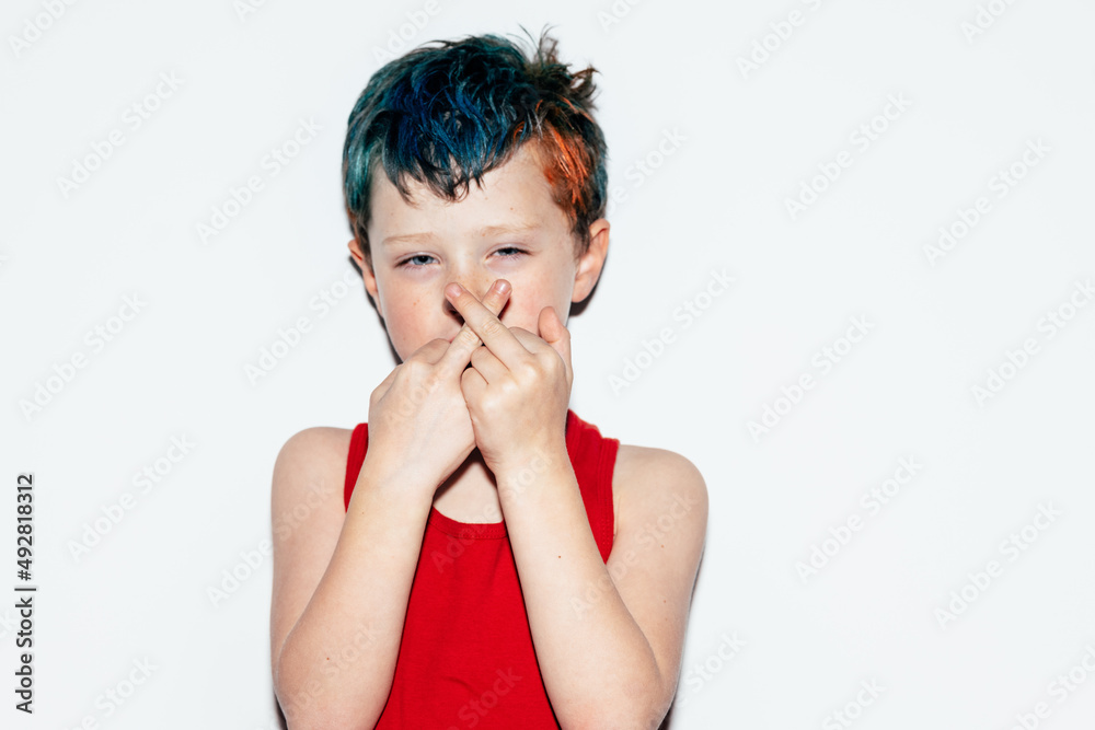 Naughty boy showing middle finger gesture Stock Photo | Adobe Stock