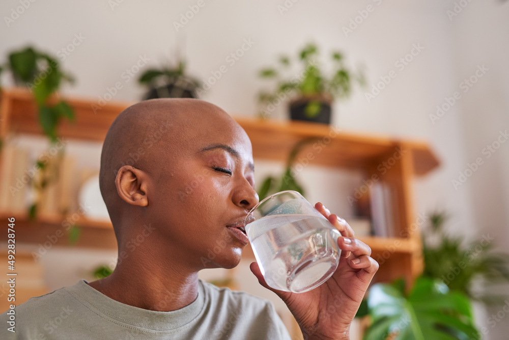 A young woman sips a fizzy effervescent flu treatment drink Stock Photo ...