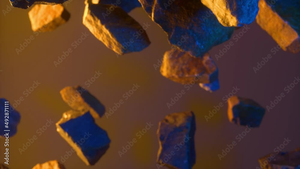 Stockvideo Rocks set on neon orange blue background. Fly rocks pieces ...