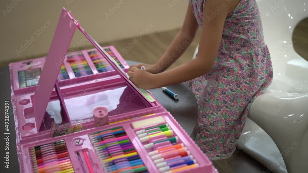 Select focus the hand of little girl coloring. Preschool activity ...
