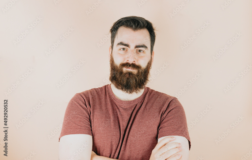 Handsome hipster bearded crossing arms while looking confident to ...