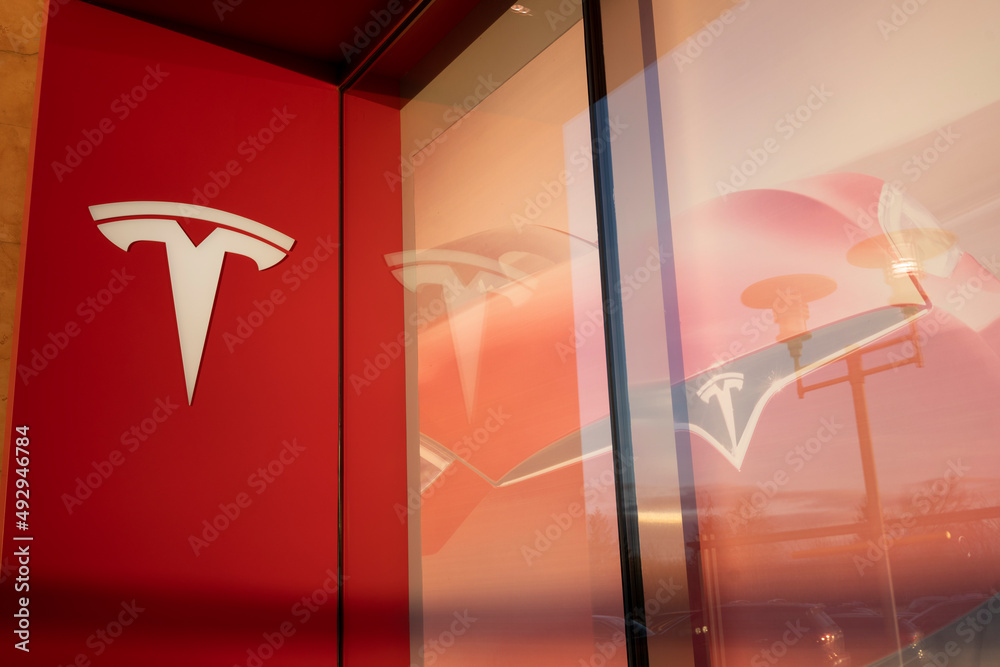 Tigard, OR, USA - Feb 5, 2022: Tesla logo is seen at the storefront of ...