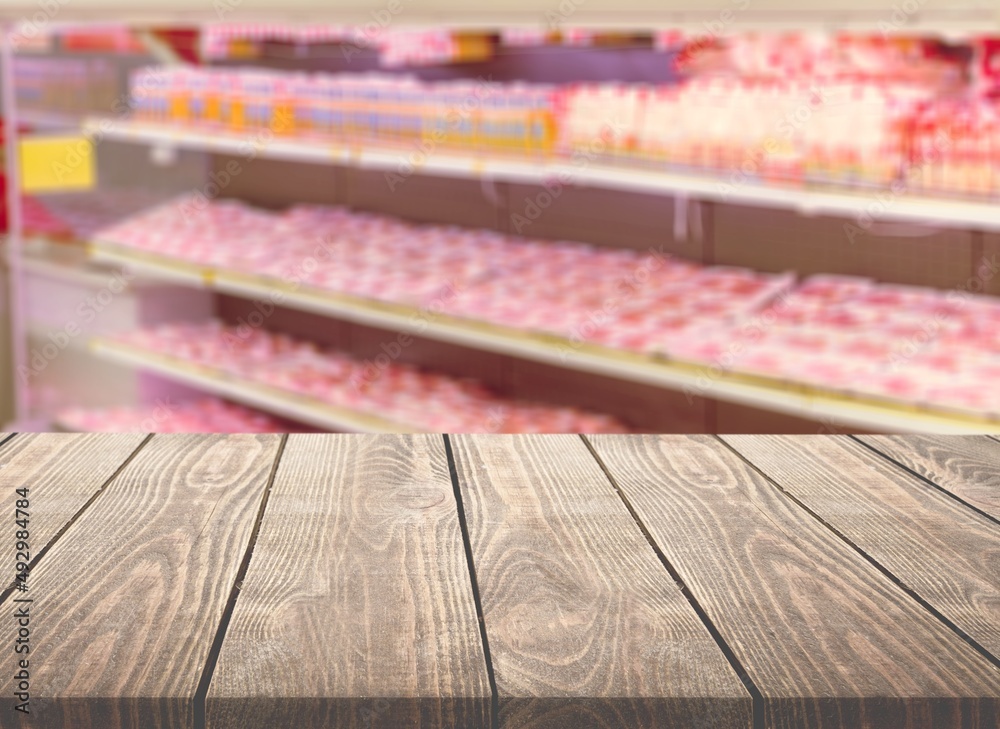 Wood table top with supermarket grocery store background for product ...