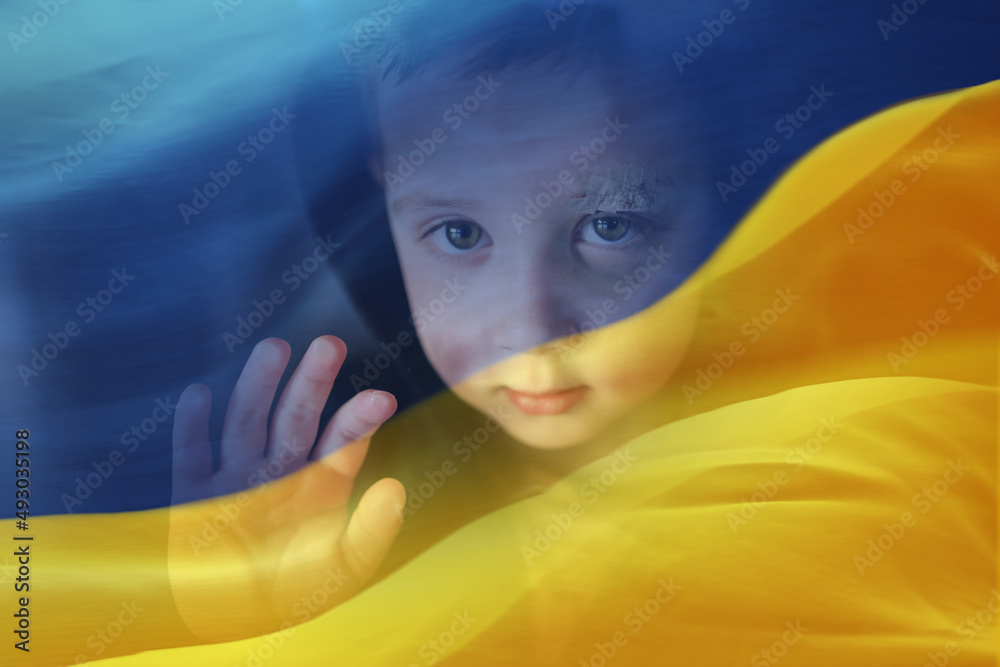 Double exposure of poor sad small boy with cut eyebrow and Ukrainian ...