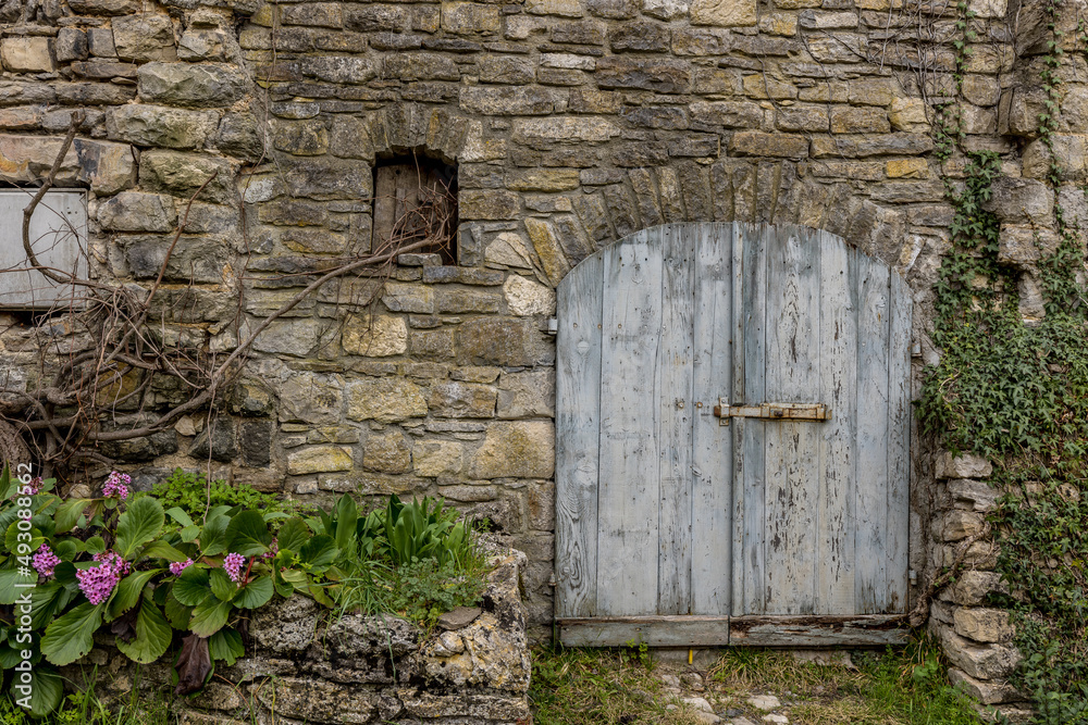 Old wooden gate in the medieval village of Rochecolombe in Ardèche ...