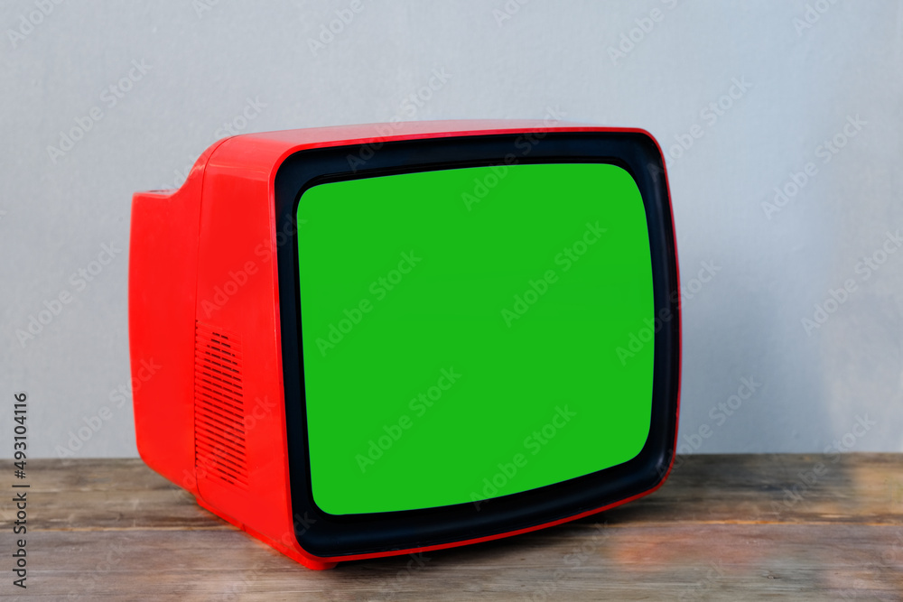 old red tube retro TV ca. 1975 with blank green screen for designer ...