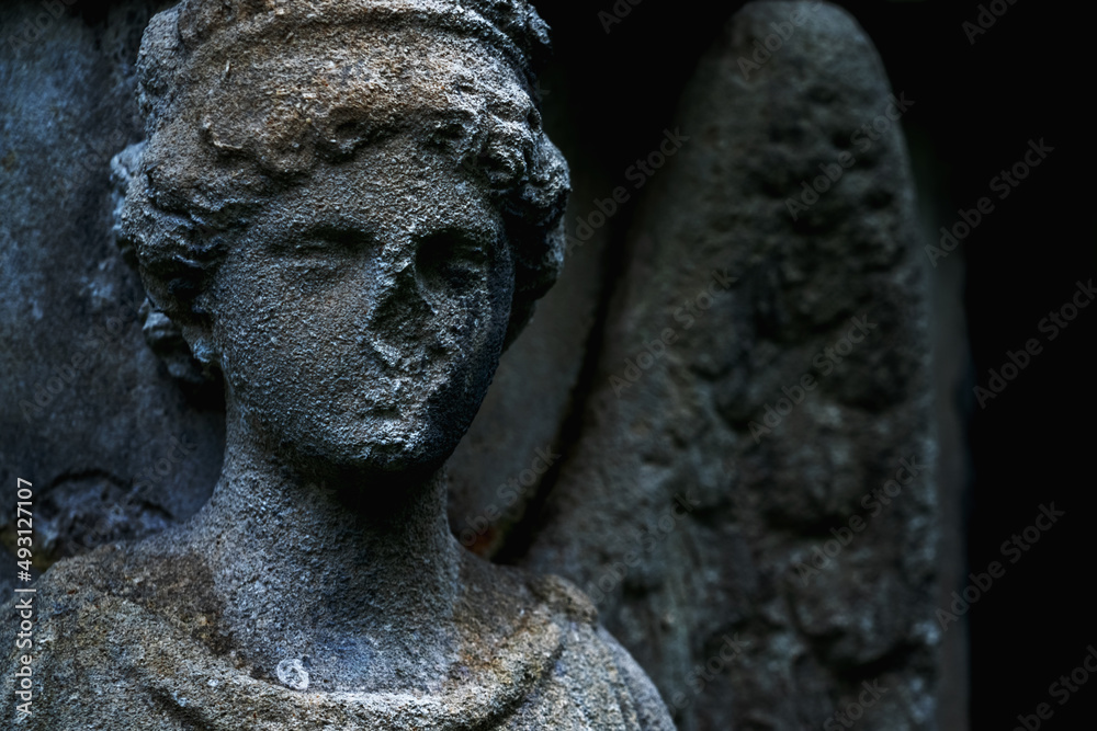 Very ancient destroyed statue of angel as symbol of death and eternal ...