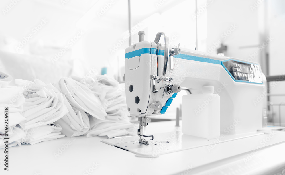 Banner industry tailor sewing machine on table workshop of white ...