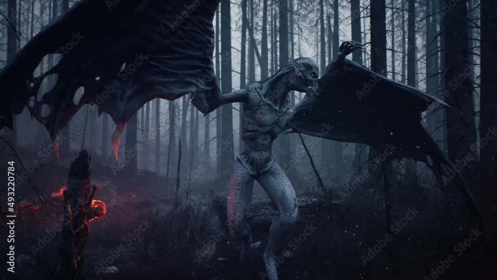 A creepy vampire stands in the middle of a burnt-out, mysterious forest ...