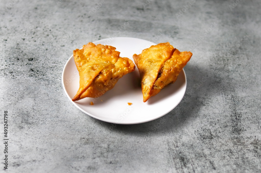 Two samosas on grey background. Traditional Indian food. and A ...