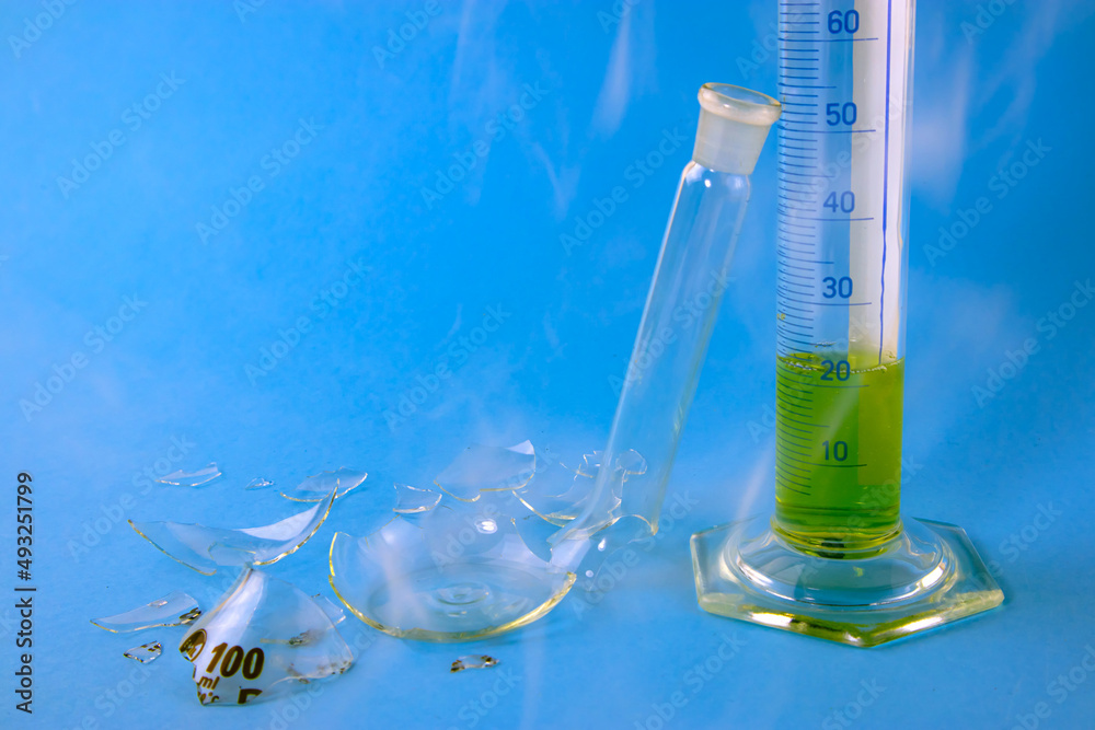 Laboratory experiment. Broken lab flask glass and measurement glass ...