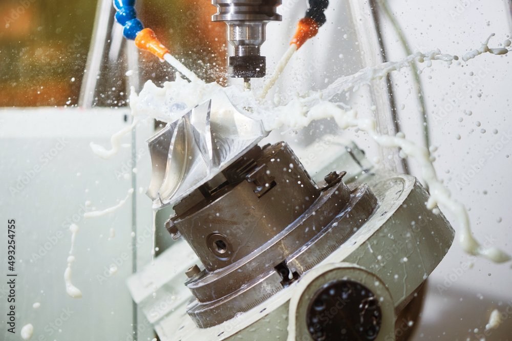 CNC milling machine work. Coolant and lubrication in gear metalwork ...