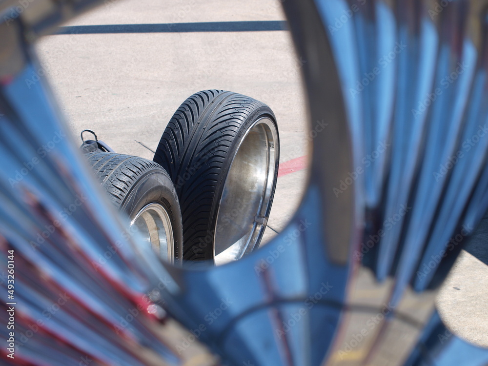 Part of a tire display outdoors shot through the rim display Stock ...