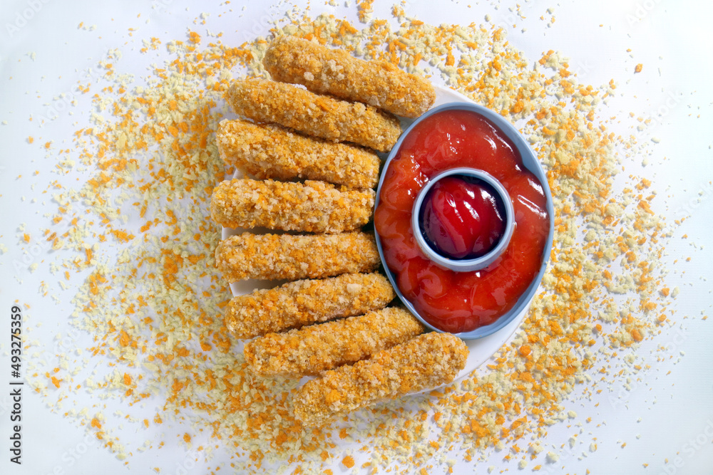 Nugget sticks fish fried crunchy line up around with ketchup on white ...