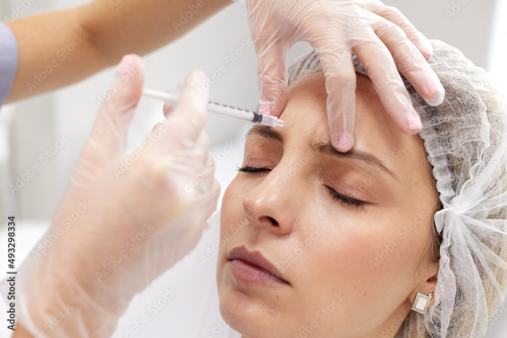 doctor giving face lifting injection Stock Photo | Adobe Stock