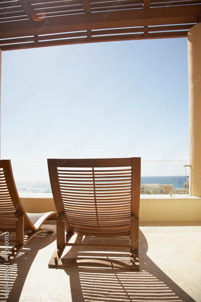 Balcony with lounge chairs at resort hotel room Stock Photo | Adobe Stock