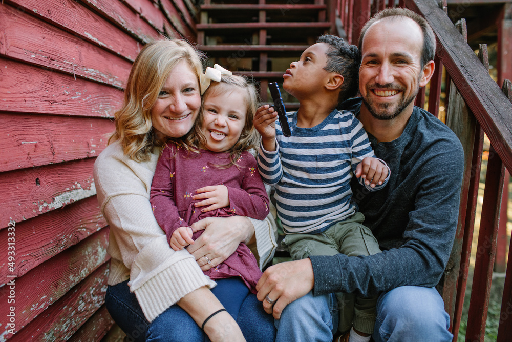 Happy Family of 4 Stock Photo | Adobe Stock