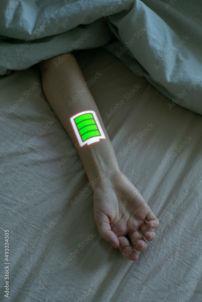 Rest in bed. Human hand with full battery symbol Stock Photo | Adobe Stock