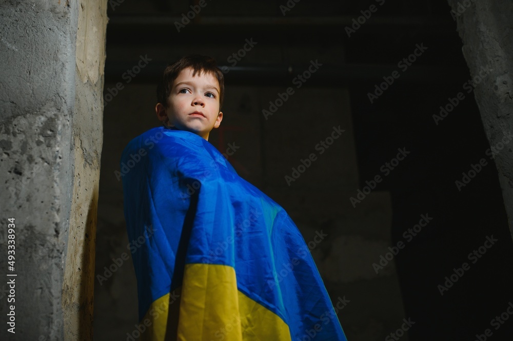 Russia's war against Ukraine in 2022. A sad boy is hiding in a bomb ...