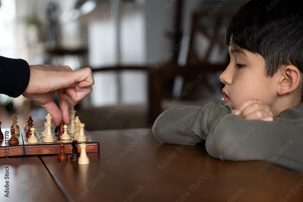 Little kid playing chess Stock Photo | Adobe Stock
