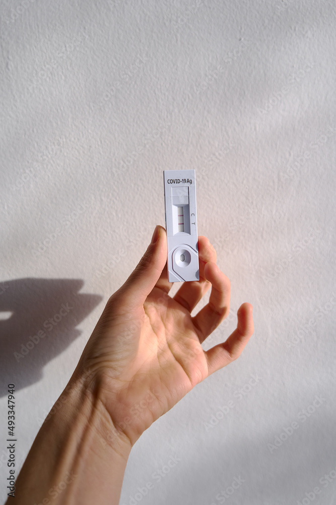 Female Hand Using A COVID-19 Antigen Rapid Test Stock Photo | Adobe Stock