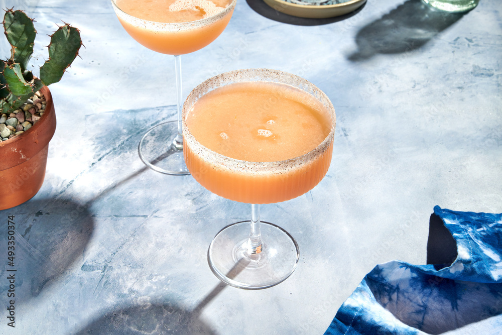 Peach Colored Cocktails in Coupe Glass Stock Photo | Adobe Stock