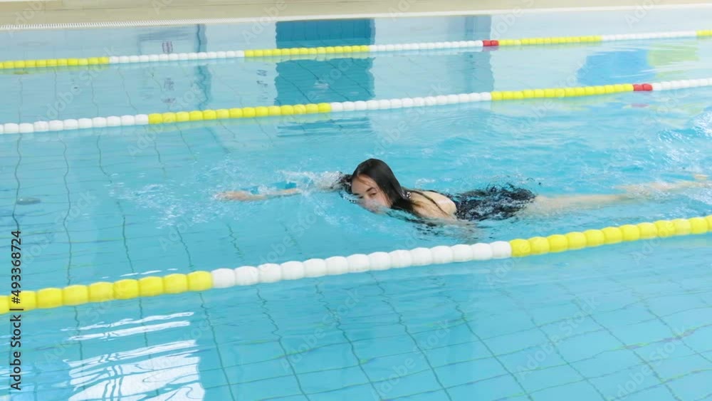 Young caucasian athletic woman female swimmer in one-piece swimsuit ...