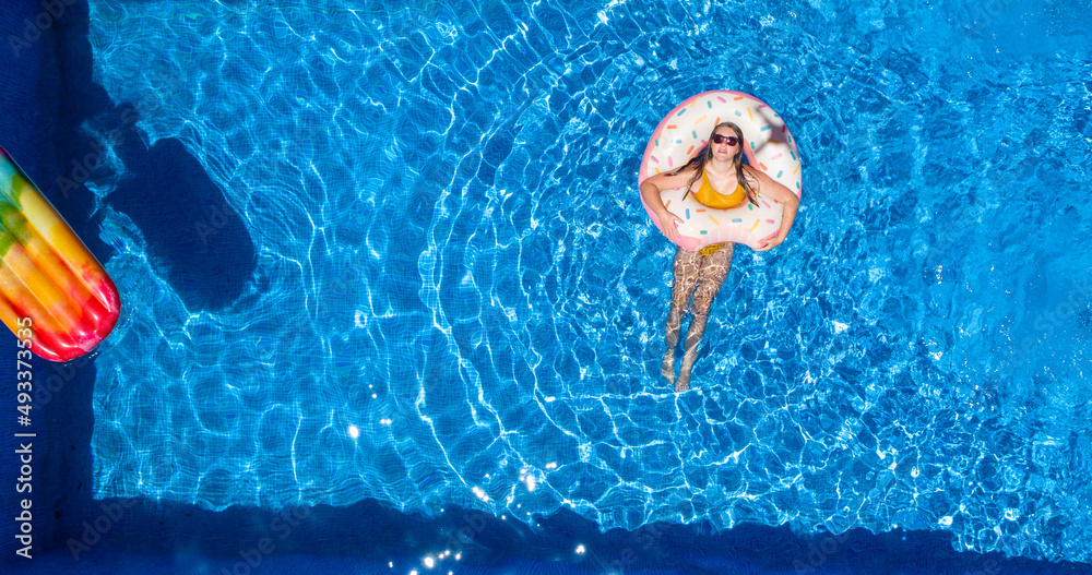 Girl in the pool Stock Photo | Adobe Stock
