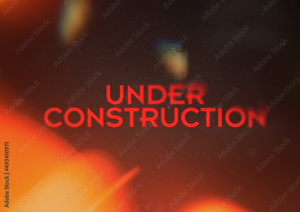 Under construction title, grunge style with grain and partial blur ...