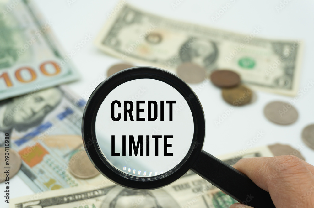 Magnifying glass showing the words "Credit Limit".Background of ...