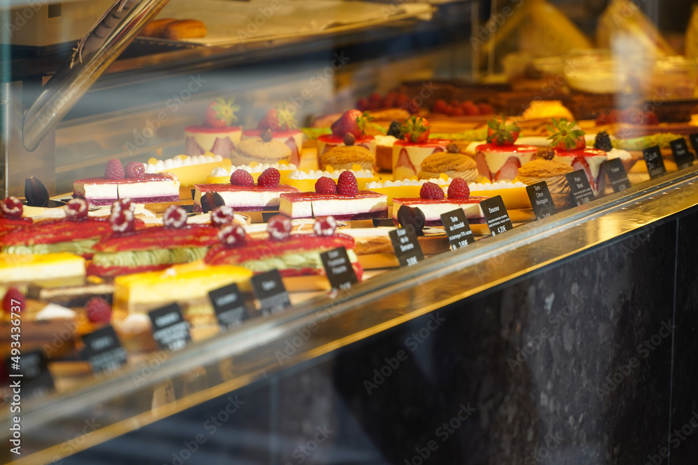 Tasty French pastry in a patisserie sweets shop from Paris. Quiches ...