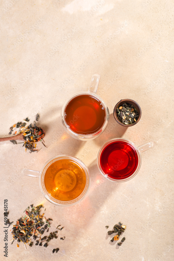 Tea of three types and colors in glass mugs with a double bottom Stock ...