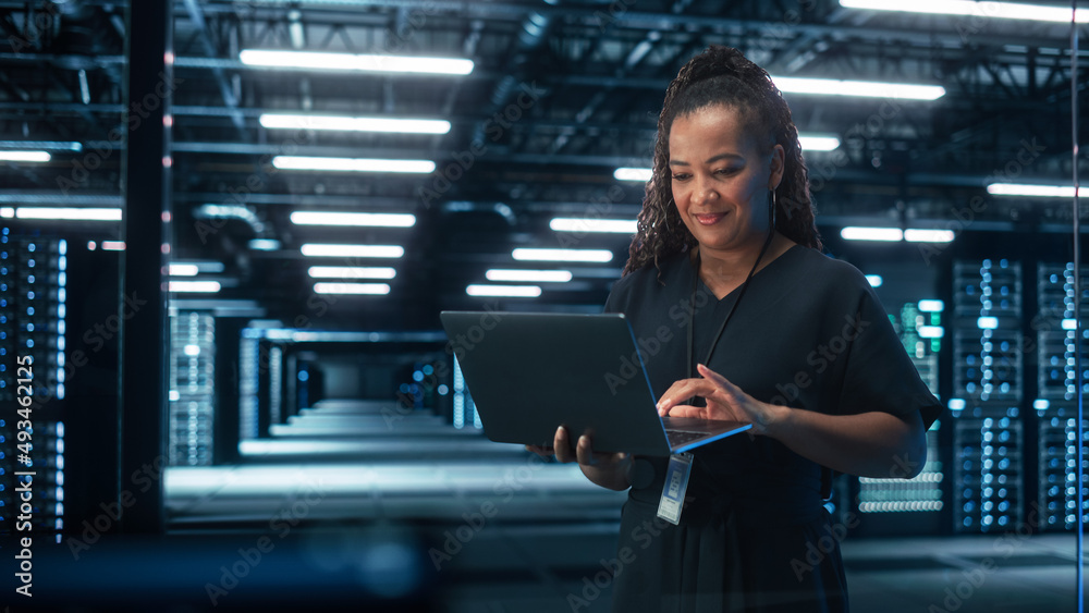 Black Female Chief Technology Office Using Laptop Computer, Standing in ...
