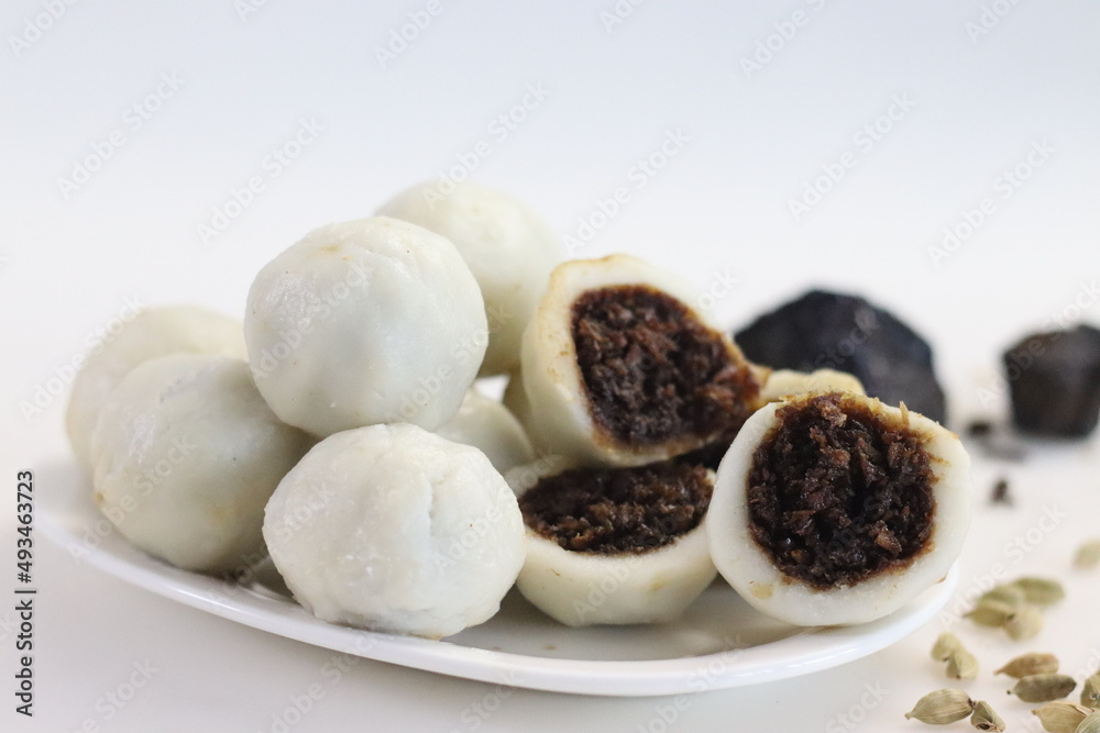 Steamed rice dumpling with a filling of palm jaggery and freshly grated ...