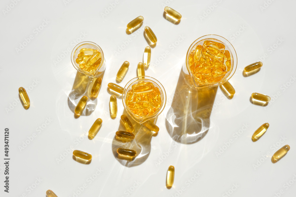omega fatty acids. Fish oil gelatin capsules in laboratory transparent ...