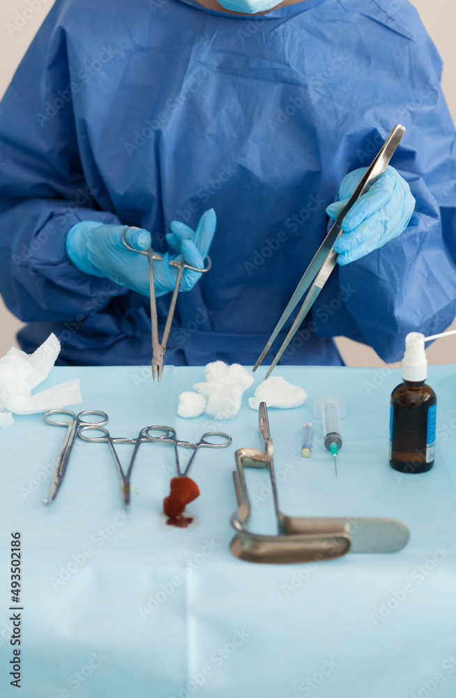 Sterile curettage instruments, forceps, retractor in the operating room ...