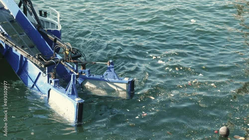 Ocean pollution concept. Special trash collector utility boat ...