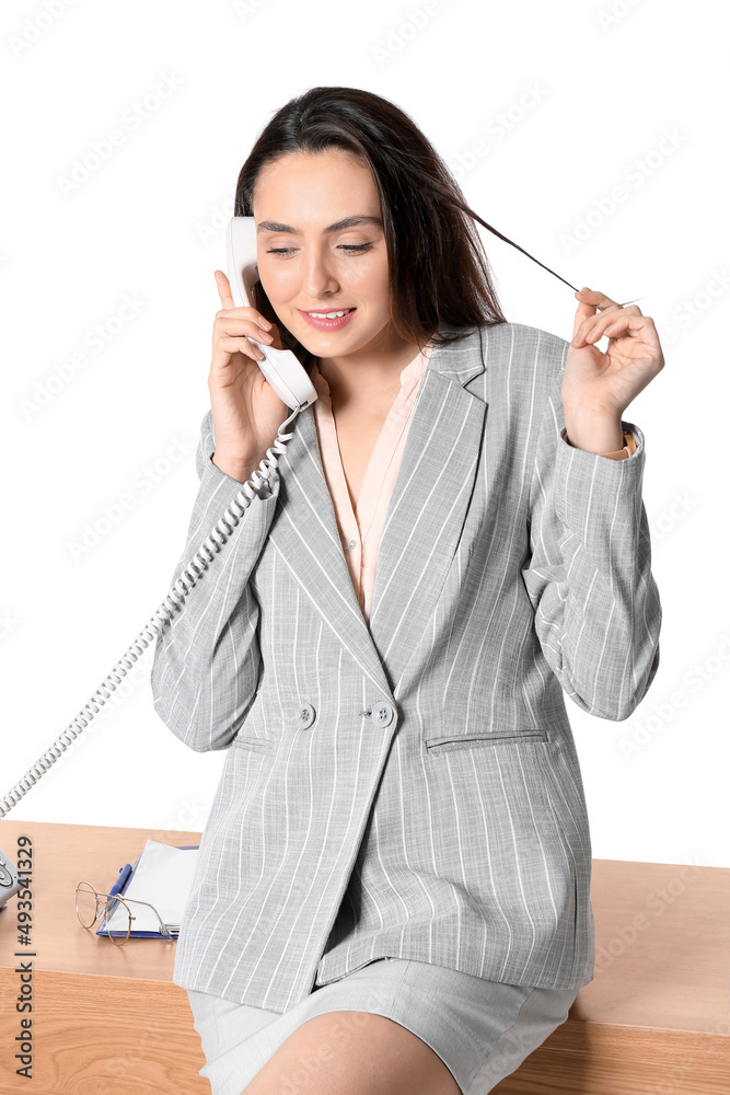 Portrait of young secretary talking by phone on white background Stock ...