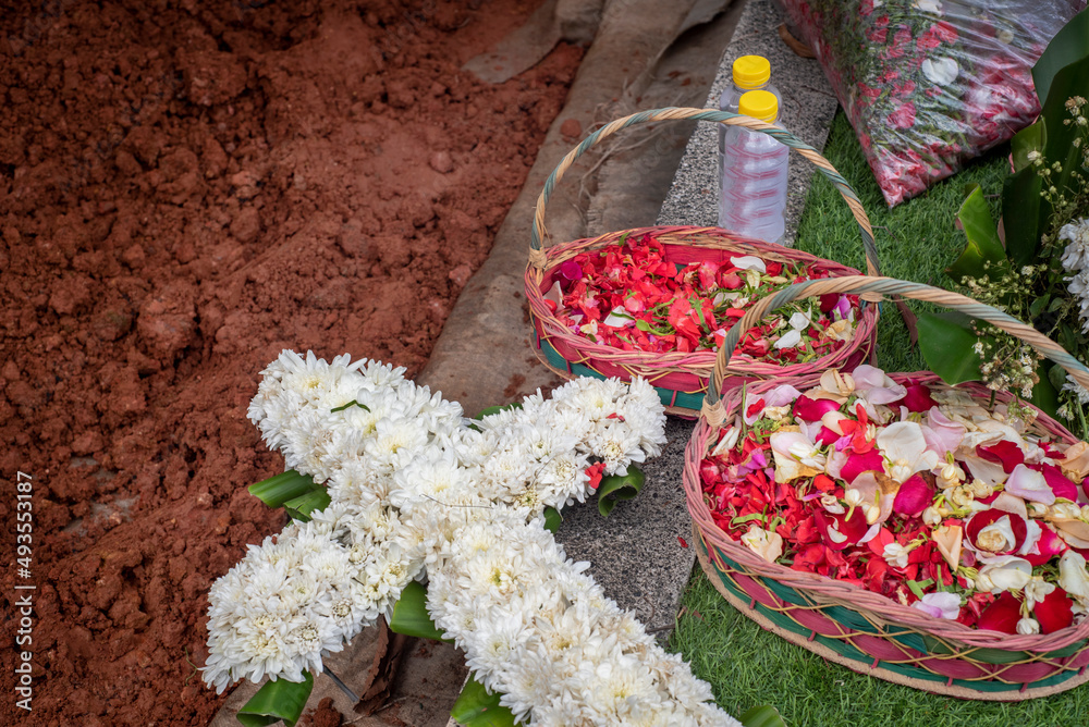 Cross bouquet on top a grave after burial ceremony Stock Photo | Adobe ...