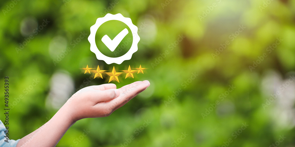 Hand shows the sign of the top service Quality, Guarantee, Standards ...