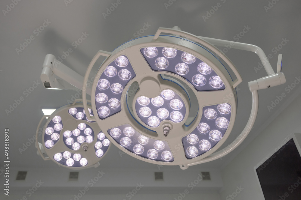 Modern operating unit. LED surgical shadowless lamp shines in the ...