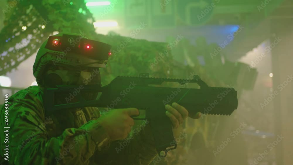 4k Side view of portrait of special force soldier or laser tag player ...