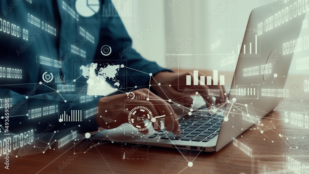 Businessman uses capable laptop computer to analyze business data ...