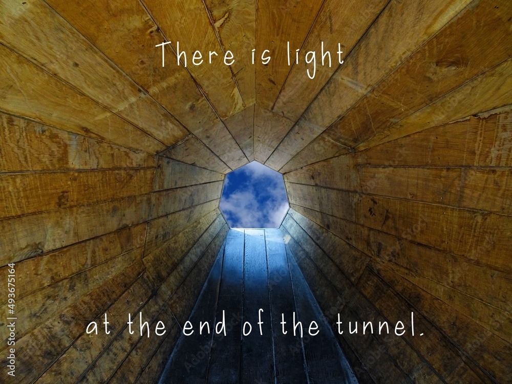 Foto de Tunnel with sky and light on the other side and quote 'There is ...