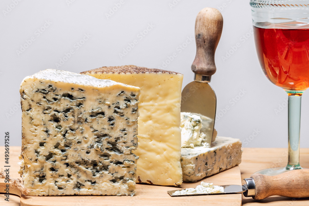 Delicious wedges of cheese of different varieties with specialized ...