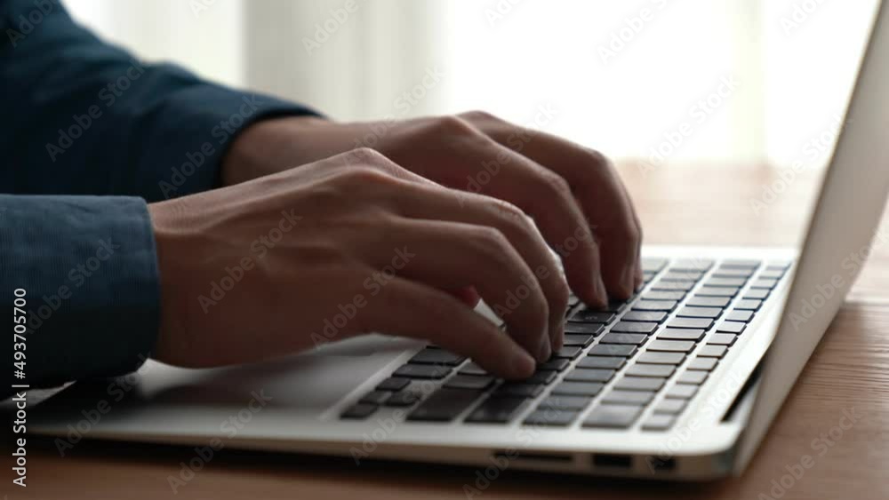Businessman hand work on capable laptop computer at office table close ...