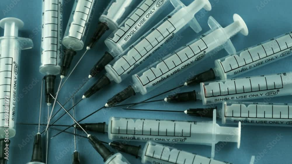 Syringes for injection, syringes for injection, slowly rotating in a ...