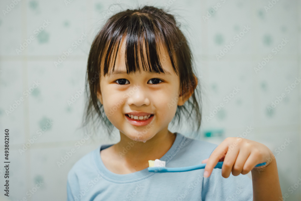 Little kids brushing teeth by herself as activity daily living. Dental ...
