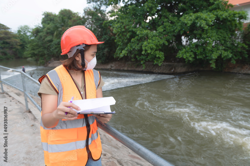 Asian Female engineering working . at sewage treatment plant,Marine ...