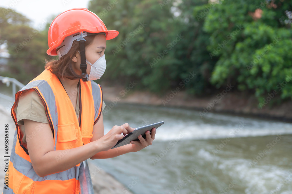 Asian Female engineering working . at sewage treatment plant,Marine ...